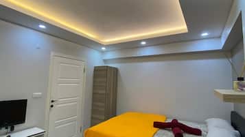 Apartamento Deluxe | 1 quarto, roupa de alta qualidade, roupa de cama fornecida