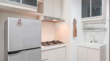 Apartamento | Cozinha privada | Um frigorífico/congelador grande, uma placa de cozinha