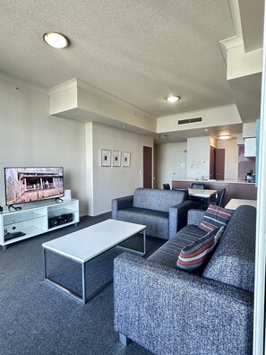 Apartamento luxo | Área de estar | TV de tela plana