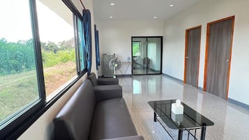 Quarto família | Área de estar | TV