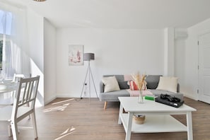Apartamento premium, 2 quartos | Área de estar
