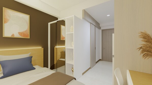 Quarto de hotel moderno com cama, mesas de cabeceira, um espelho e porta para um banheiro.