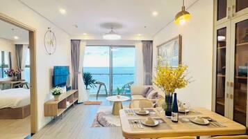 Apartamento premier | Área de estar | Smart TV 49 polegadas com canais a cabo