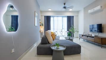 Apartamento executivo, 2 quartos, vista para a cidade | Área de estar | TV de tela plana