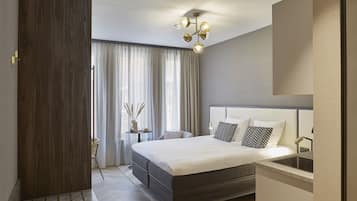 Quarto Deluxe | 1 quarto, cofre com capacidade para portátil, secretária