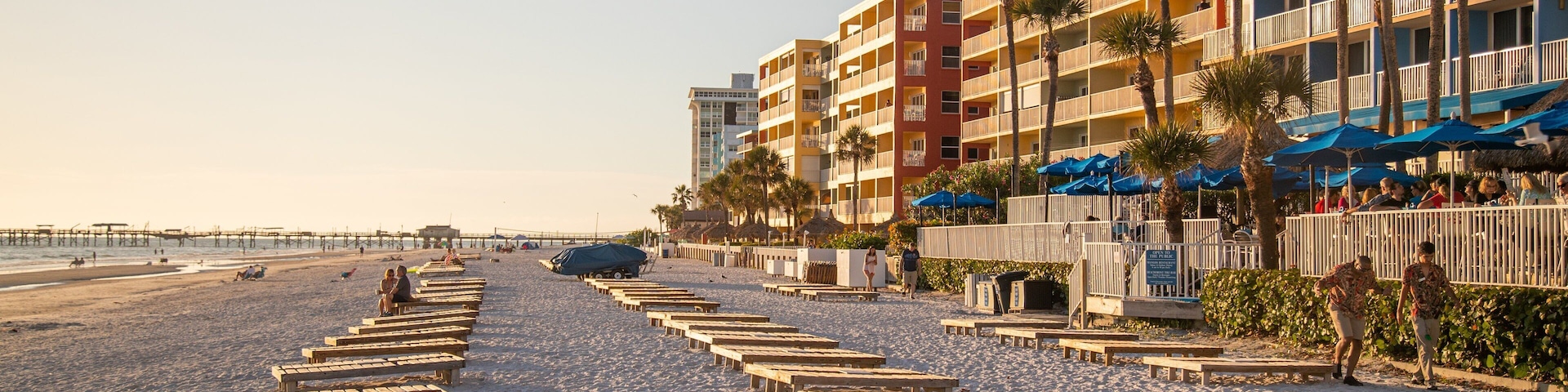 Redington Beach which includes a sunset, a beach and general coastal views