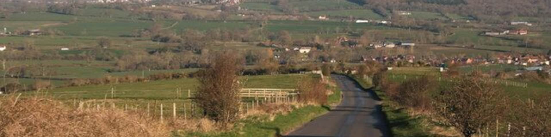 Okeford Hill The steep road down from Okeford Hill with the Blackmore Vale in the distance
