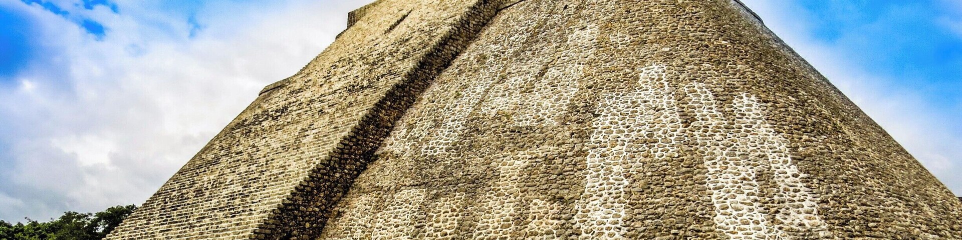 Pyramid of the Magician in the ancient, Pre-Columbian city of Uxmal, Mexico. The structure is also referred to as the Pyramid of the Dwarf and the Pyramid of the Soothsayer. The pyramid is the tallest and most recognizable structure in Uxmal. Easily accessible from the city of Merida.