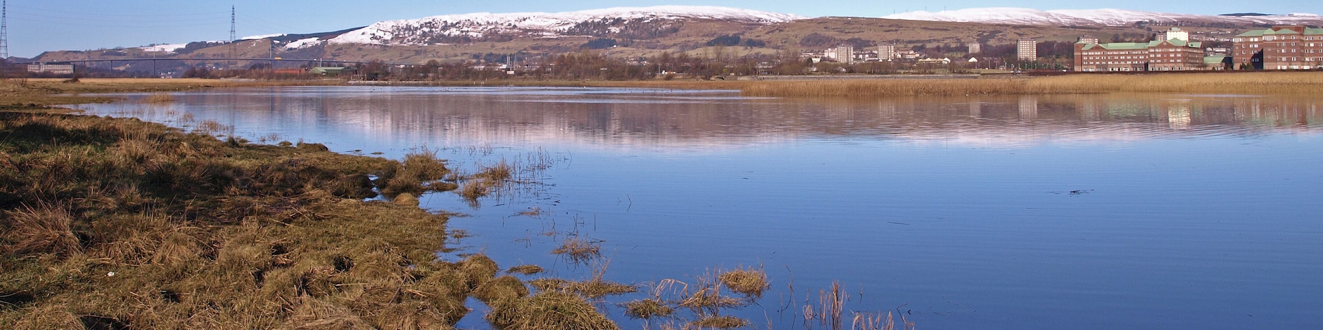 Newshot Island Inlet, River Clyde Looking downstream to the Erskine Bridge. Clydebank hospital on the right. Kilpatrick Hills in the distance.