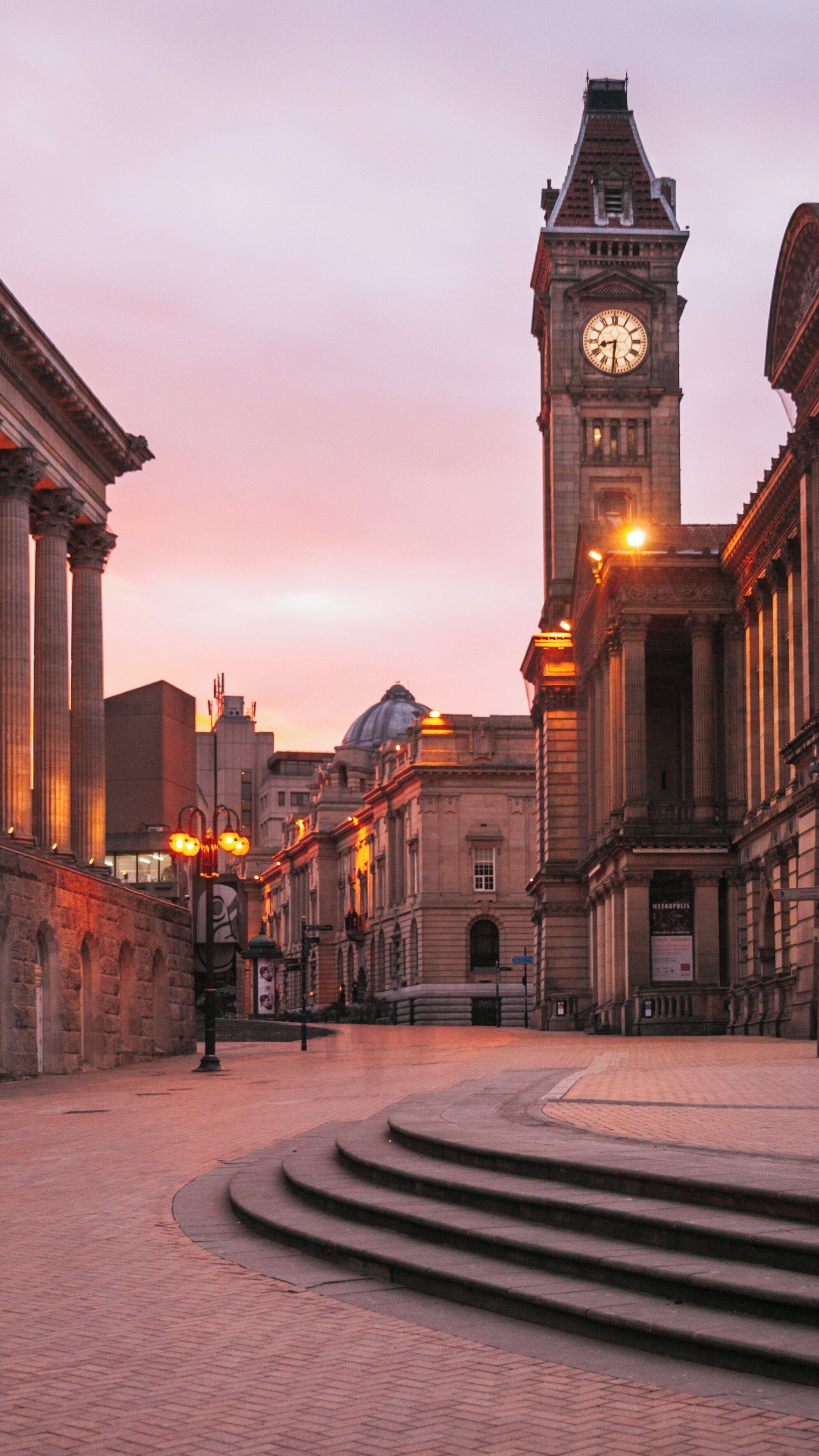 Evening atmosphere at Victoria Square in Birmingham City Centre showcasing historic architecture and vibrant lighting
