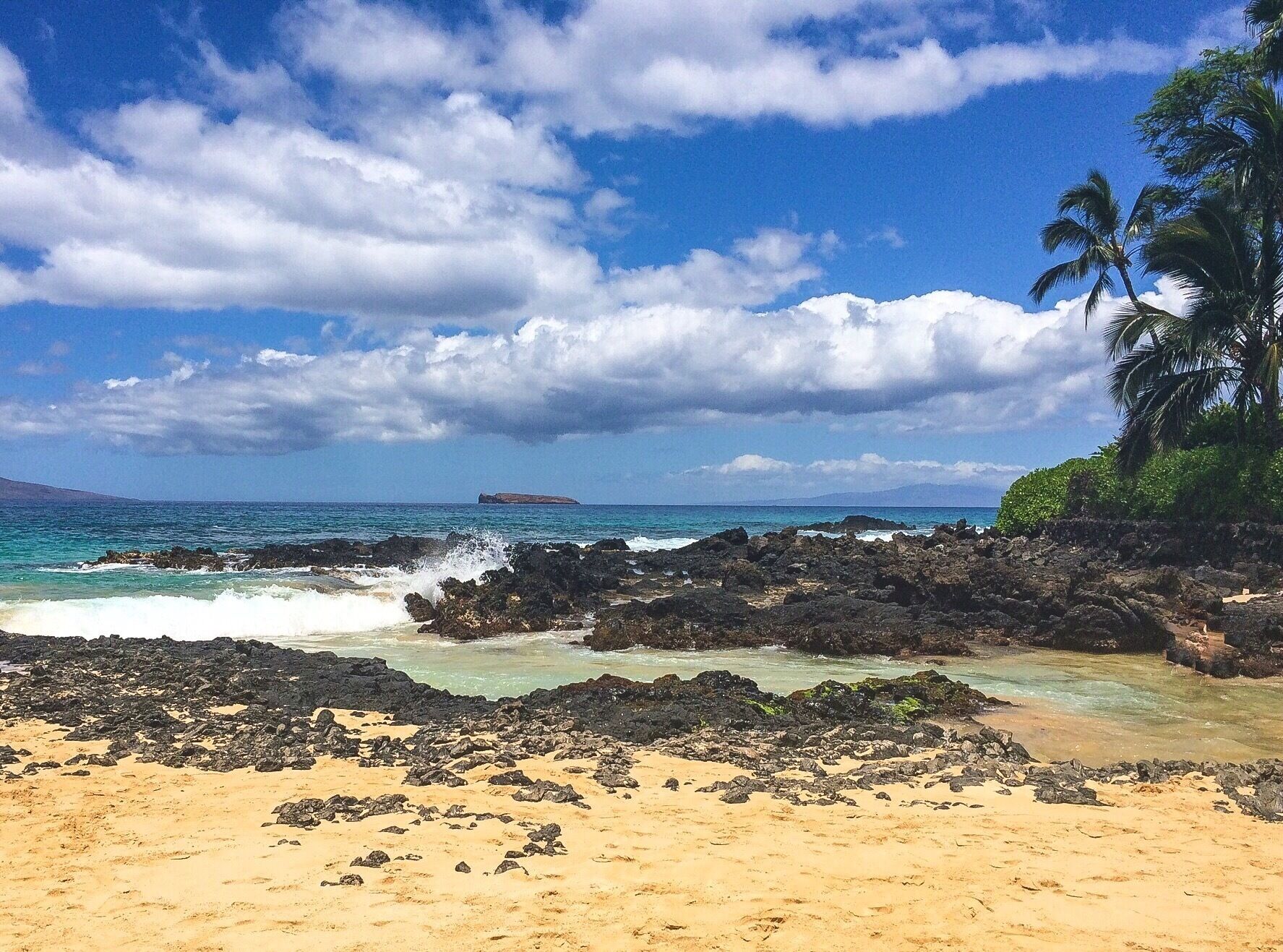 This beach is known as Secret Beach, but it isn't much of a secret. However, it's a beautiful spot tucked away behind a small opening in a rock wall and totally worth seeking out. A lot of couples choose to get married here at sunset, hence its other nickname of Wedding Beach.