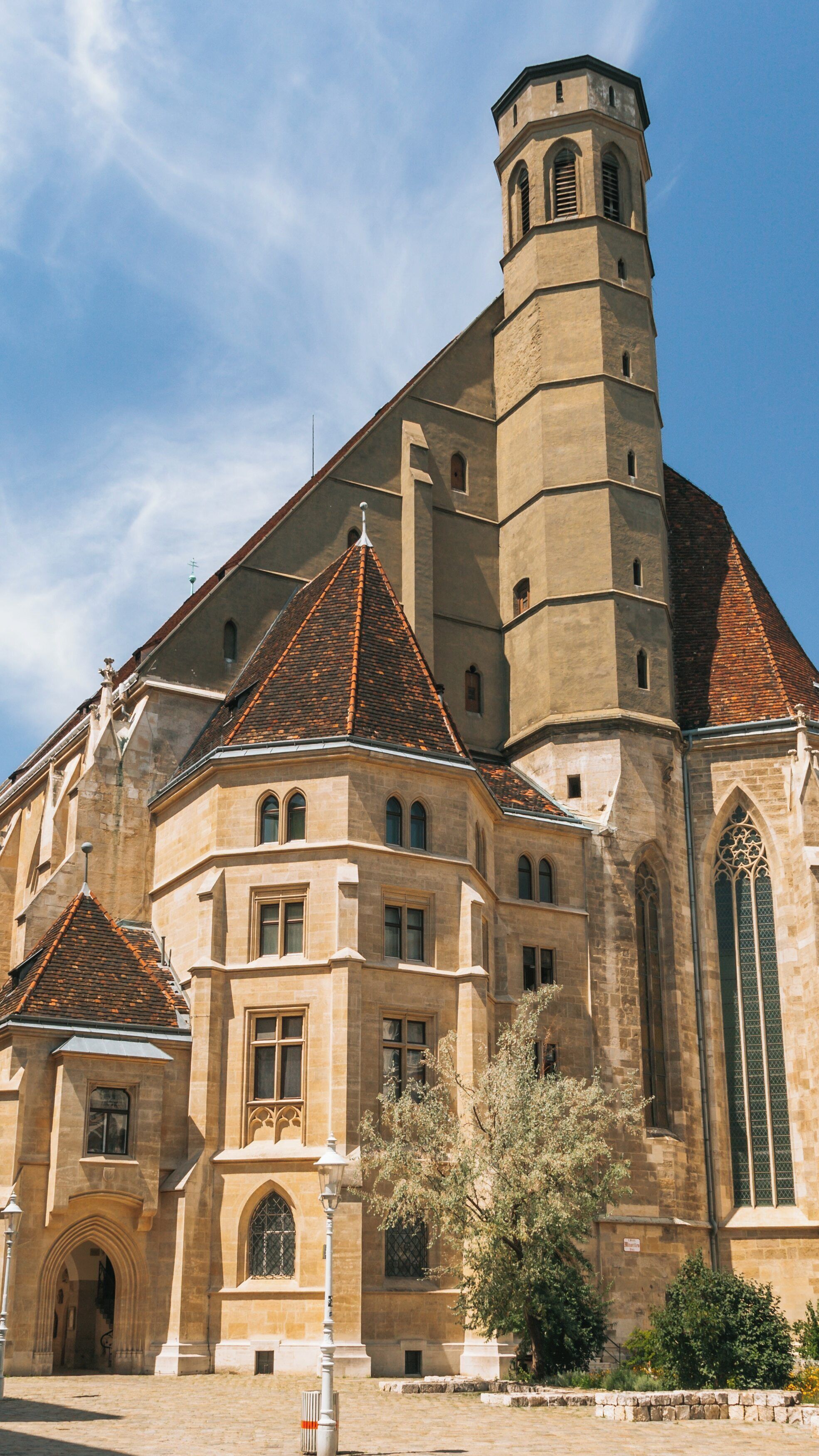 Minorite Church stands majestically in Innere Stadt, Vienna, showcasing its unique architecture and historical significance under a clear blue sky