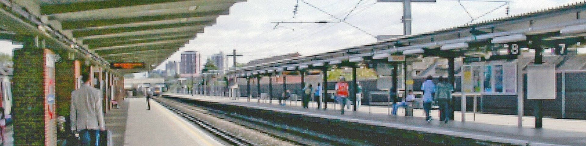 West Ham (High Level) Station. View westward, towards London on the LUL District/Hammersmith & City Line from Barking and Upminster. On the right are the platforms on the ex-Midland (LT&S) Fenchurch Street - Shoeburyness line, now c2c. The station was renamed 'West Ham Manor Road' in 1924 until closure of the LMSR platforms due to war damage 7/9/40 and were restored for c2c in 1999.