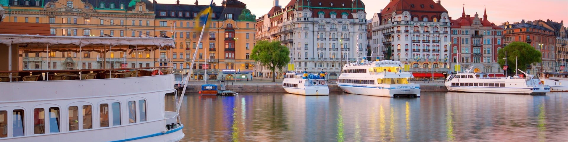 Ostermalm which includes a bay or harbor, a sunset and a city