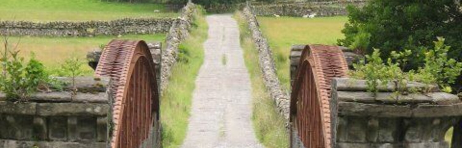 Auchindrean Bridge Track leading to Auchindrean over a bridge designed by Sir John Fowler.