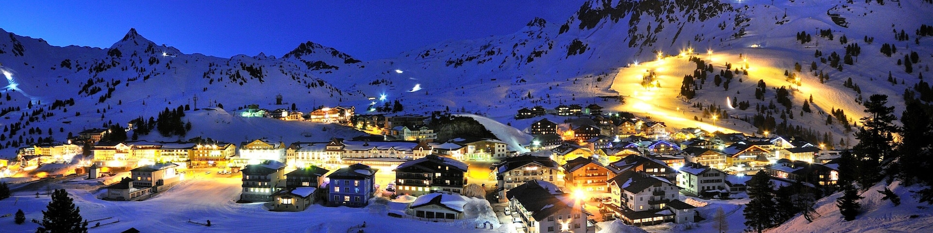 Obertauern featuring a small town or village, night scenes and snow