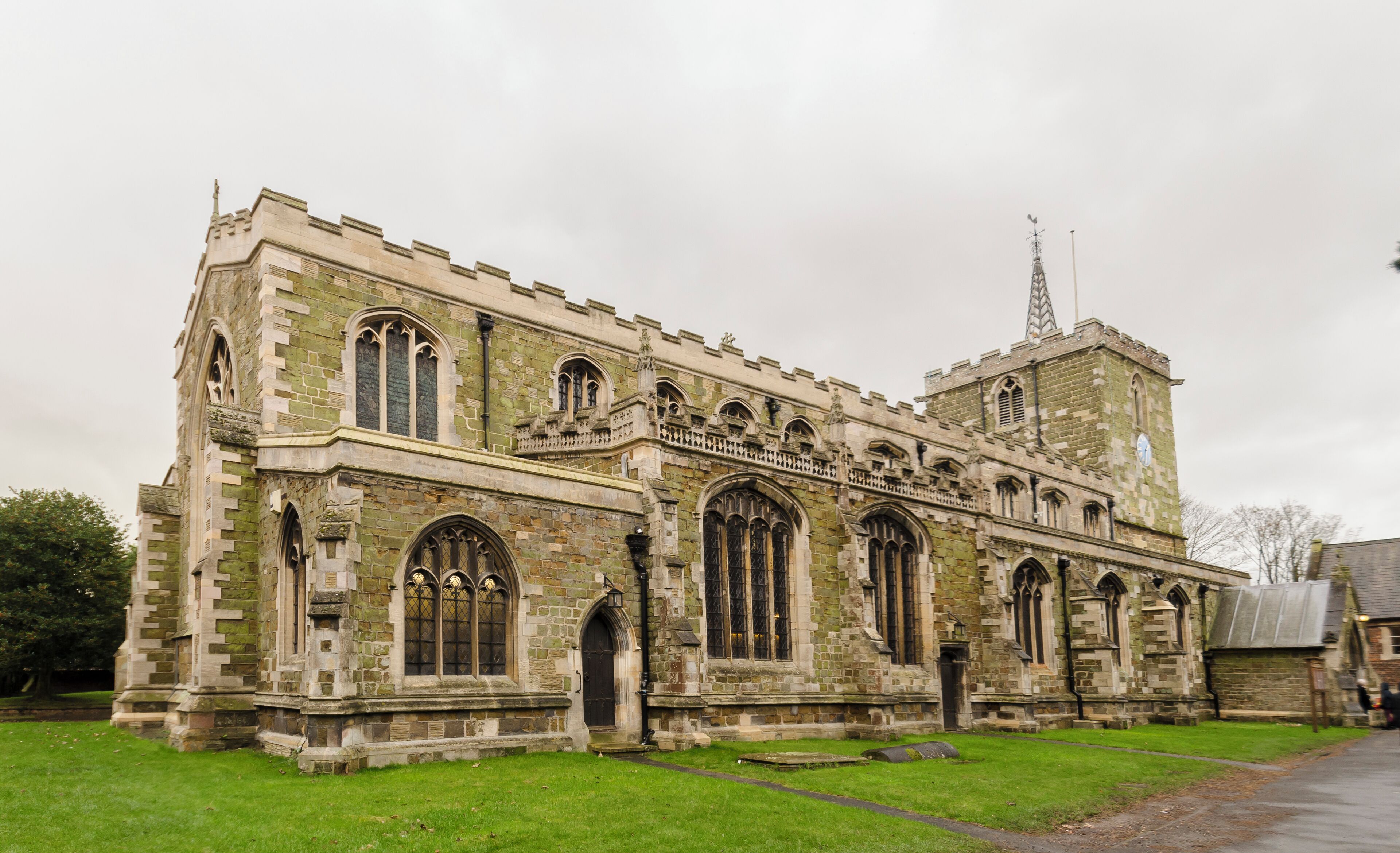 Grade II listed The church dates from the early 13th century onwards, and was restored in 1859-61 by Ewan Christian. It is built in green sandstone and has a west tower with spirelet, nave with north and south aisles, chancel with north and south aisles, north porch and vestry. The tower dates from circa 1200, and was remodelled in 1861. The upper part is from the decorated period. The nave arcades are of five bays and date from the early 13th century. These were restored in 1861. The chancel has 15th century arcades, two to the north and three south, again heavily restored. The chancel arch dates from the Victorian restoration. The reredos also dates from this time, and is by C. E. Giles. There is a Memorial brass to Sir Lionel Dymoke, died 1519, he was knighted at Siege of Tournai, and was Sheriff of Lincolnshire 1516. On the wall of the south aisle are mounted 13 scythes, which were thought to have been used in the Lincolnshire rising of 1536, although this is unlikely , despite Horncastle being one of the centres of the rebellion. There are several stained-glass windows, with some by Heaton Butler and Bayne, and one by Preedy. The church pipe organ was recently replaced with a new digital version. The freed up space has been converted into a Coffee area.