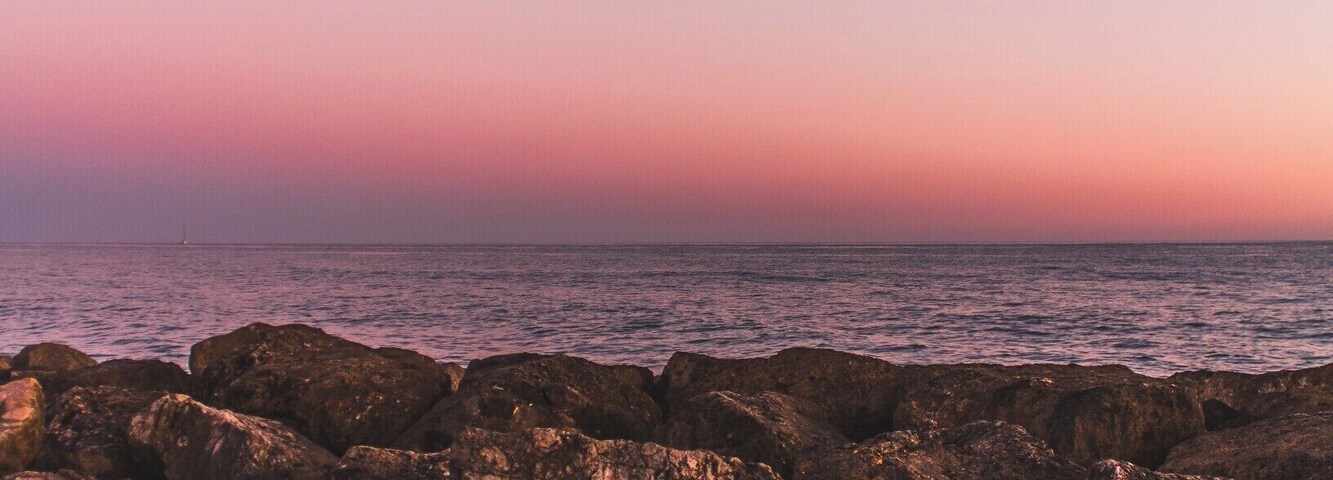 Especially love this photo becasue you can see the transition in colours in the sky and also loved how clear the reflection of the moon wasi n the water. #Barcelona #Beach #Moon #Colourful