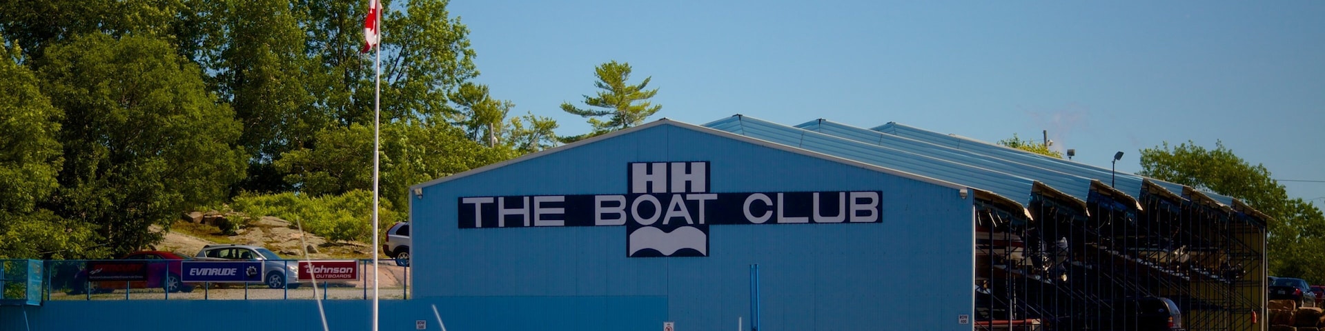 Honey Harbour which includes signage and a bay or harbor