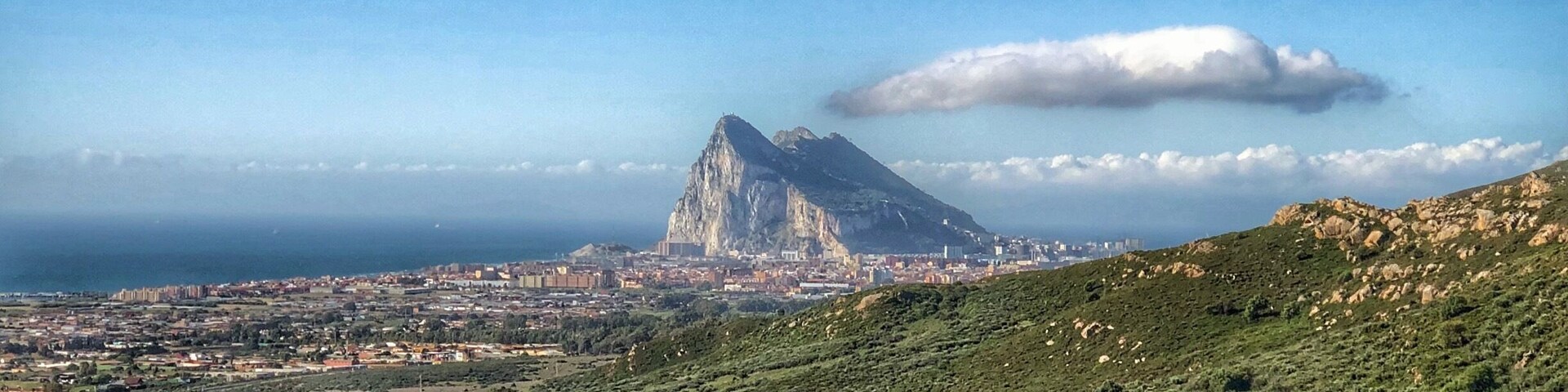 Standing in Spain, looking towards the Rock of Gibraltar.