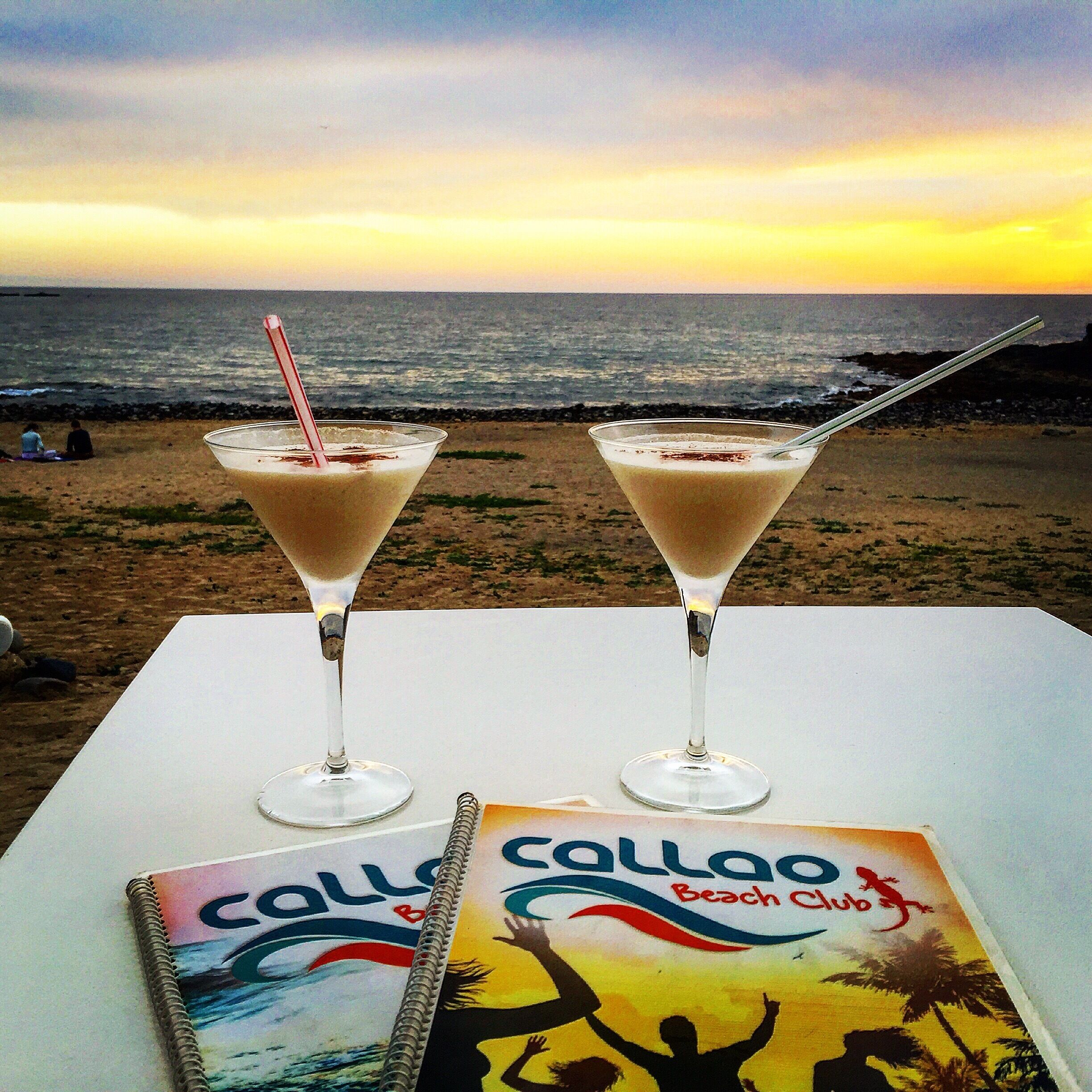 Cocktails on the beach at sundown, bliss!