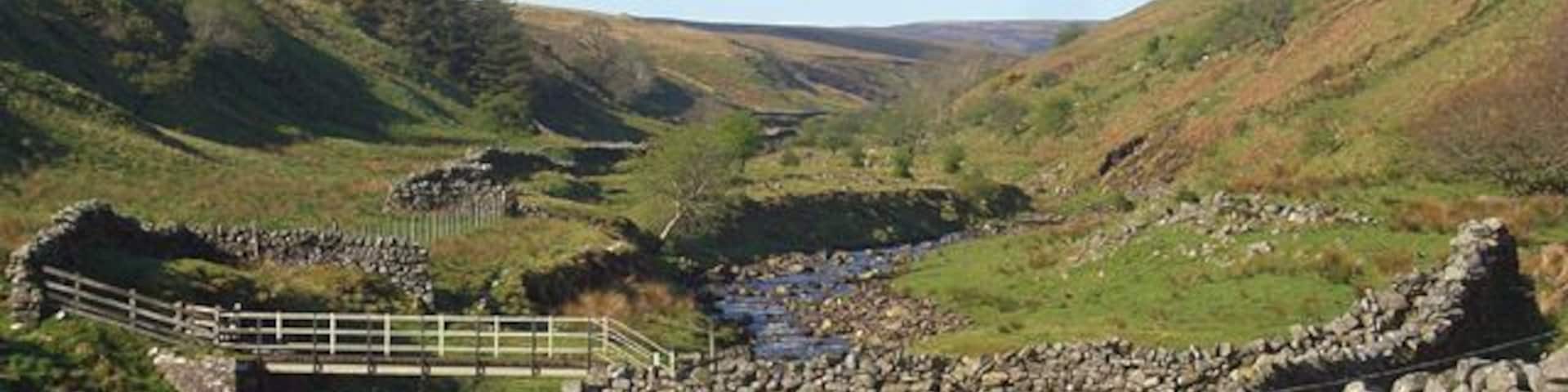 Gilderdale With the Pennine Way footbridge crossing the burn.