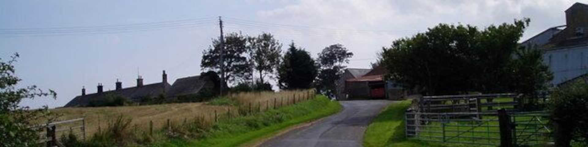 Windmill Hill Farm Cottages on left