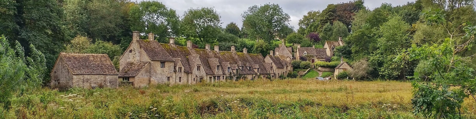 Bibury is a village and civil parish in Gloucestershire, England. It is on both banks of the River Coln which rises in the same District and which is a Thames tributary. The village is centred 6 ¹⁄₂ miles northeast of Cirencester. Wikipedia