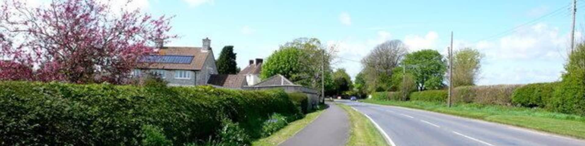 Charminster old Dorchester road. This used to be the main road from Charminster to Dorchester when the main roads kept to higher ground to avoid marshy land on the flood plain of the River Frome. A new road was built centuries ago on a raised causeway across the meadows and it became the A37 running south of the village. This is now the C12 to Sherborne, straight , fast and notorious for road deaths.