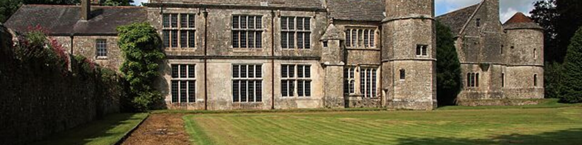 Wolfeton House South Front A rough track leads off the main Dorchester - Yeovil road at the end of which is a magnificent C16 manor house. Like many such houses, it has had quite a chequered architectural history, with the oldest surviving parts, being the south front completed in 1528, and the gatehouse (extreme right), dating from 1534. The ancestral home of the Trenchard family, it survives today having been rescued from dereliction by the present owners. Grade I Listed.