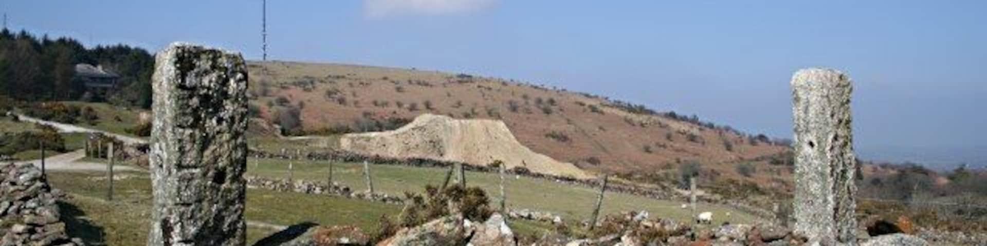 Caradon Hill Looking at the southeastern side of the hill. In the mid ground is an old mining waste tip and on top of the hill is the television transmitter mast.
