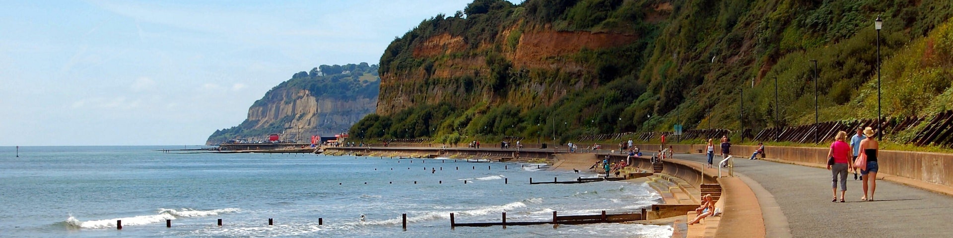 Sandown Bay is a broad bay which stretches for much of the length of the Isle of Wight's southeastern coast. It extends ten kilometres from Culver Cliff in the northeast to just south of Shanklin in the southwest. The towns of Shanklin and Sandown are located on the bay's coast. The seabed is a mixture of sand, shells and gravel. The beach is predominantly sand. The bay is best viewed from Culver Down to the north. The Isle of Wight Coastal Path follows the whole bayline either along the cliff top to the south of Sandown or the concrete seawall north of Sandown.