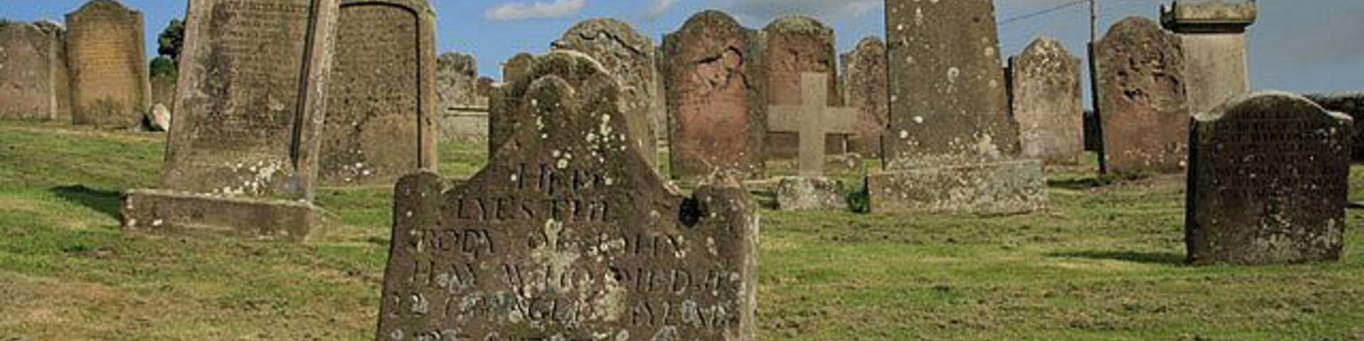 Chirnside Parish Church graveyard An interesting mix of headstones at the corner of the square. 4 squares converge in this graveyard. The kirkyard was the site of a famous resurrection in 1764 when Marjorie Halcrow Erskine, the second wife of the Revd Henry Erskine, was laid to rest in a shallow grave by the sexton who later returned to steal her jewellery. While he was trying to cut off her finger to steal a ring, the corpse awoke and dashed off across the kirkyard to the manse door, which she pleaded the minister to open For Im fair clemmed withe cauld. Apparently, in her additional years of life, she gave birth to two sons, Ralph and Ebenezer Erskine, who founded the Secession Church. The fate of the sexton is not known