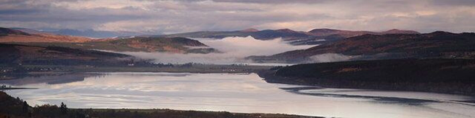 Kyle of Sutherland from Struie Hill viewpoint. Ben Mor Assynt obscured by low cloud.