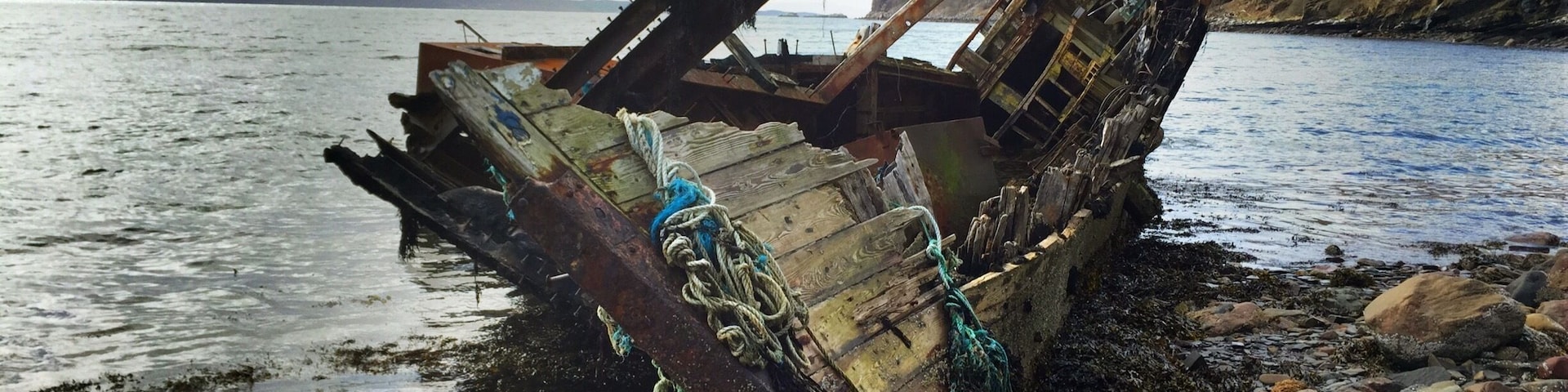 Wrecked boat on the beach at Diabaig. I've googled this but the identity of the boat and the story behind it seems to be unrecorded. If you look closely you can see the toilet still in place inside the boat! Diabaig is a 20 minute drive from Torridon along a spectacular single-track road over the Bealach na Gaoithe. Should you go, be sure to eat at the Gille Brighde beside the beach in Diabaig.