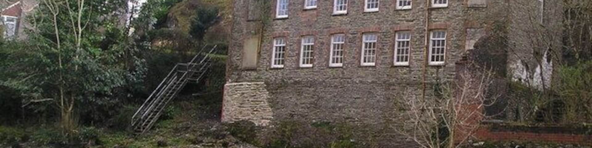 Allt-y-Cafan Mill and weir, Llandysul, Wales. One of the water-powered woolen mills in south west Wales that flourished a century ago.
