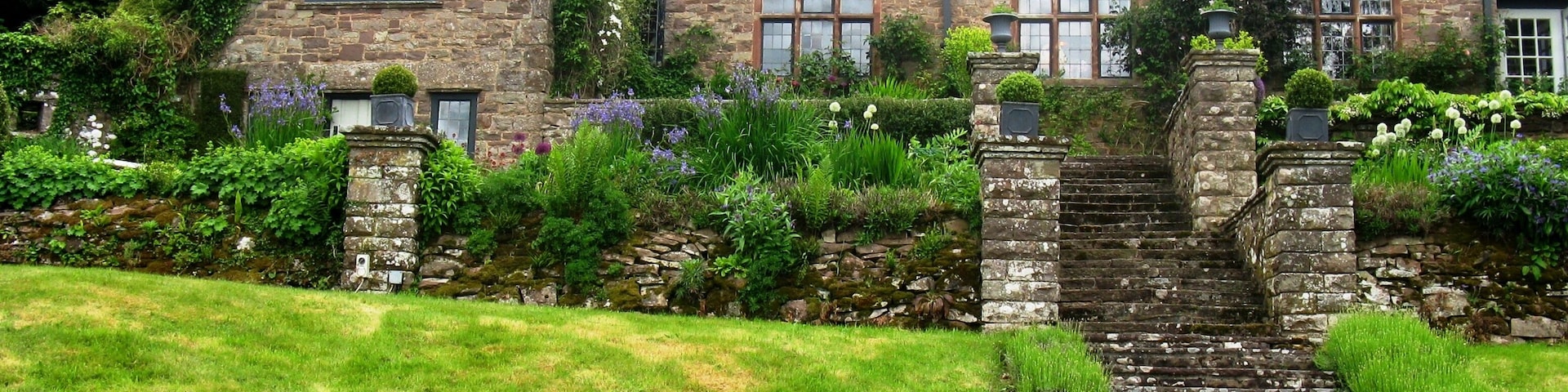 Looking up at High Glanau Manor from the pond. High Glanau (also known as High Glanau Manor) is a country house and Grade II* listed building within the community of Cwmcarvan, Monmouthshire, Wales.