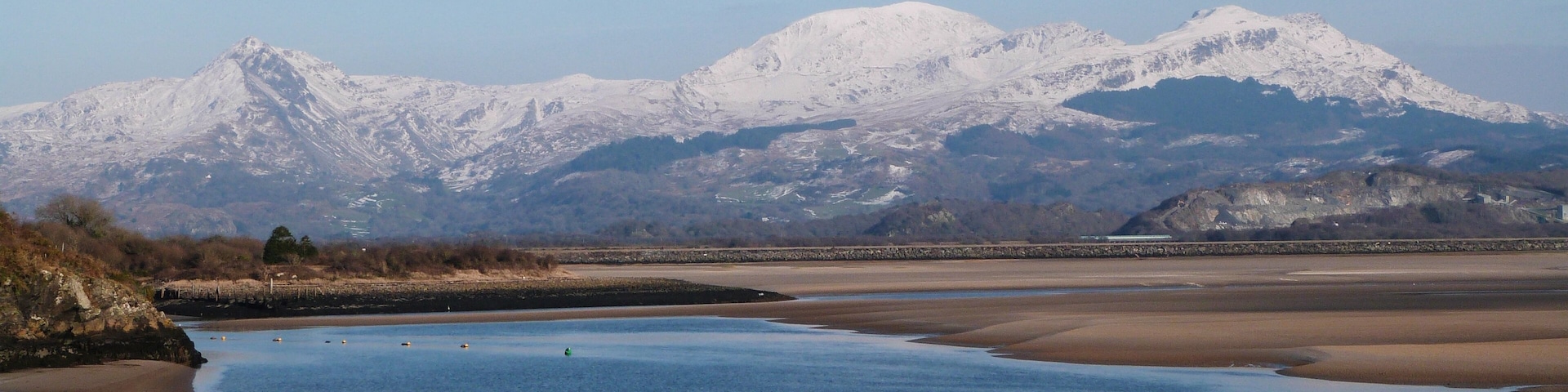 Afon Dwyryd that is joined by Afon Glaslyn from the left. Looking up to Moel Ddu in the background. The landscape is all within Snowdonia National Park, the oldest national park in the world.