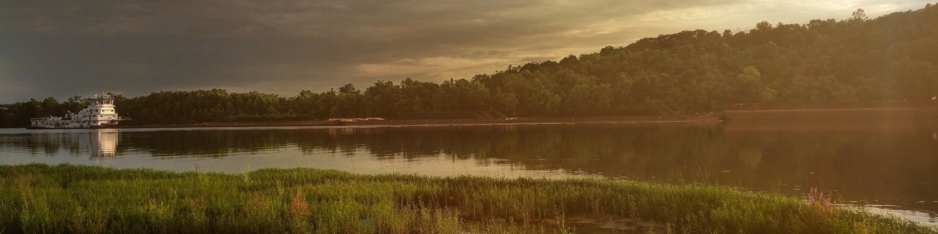 Barge heading into the sunset on the Ohio River.
