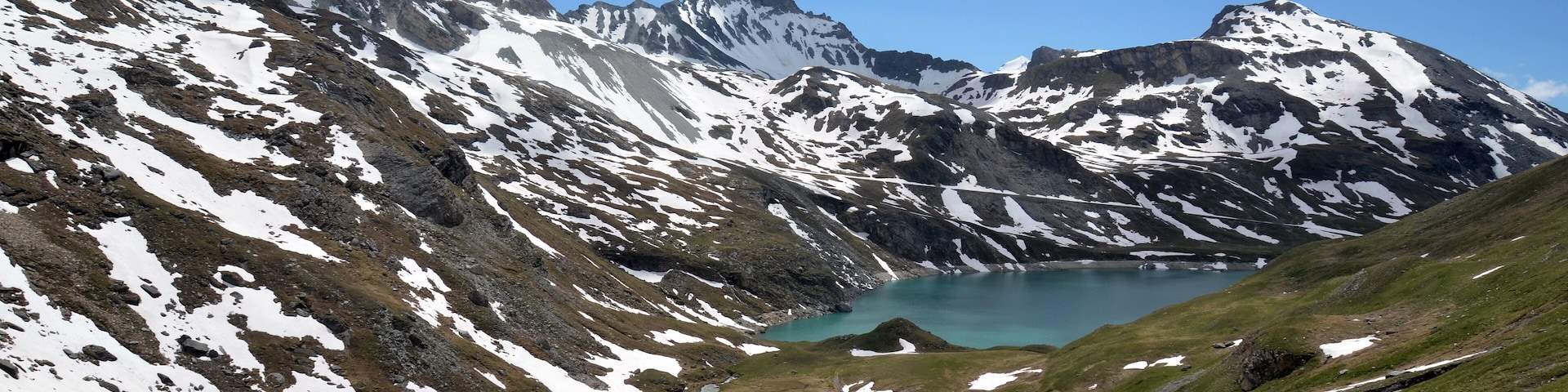The barrier lake lac de la Sassiere when going up to Glacier de Rhemes