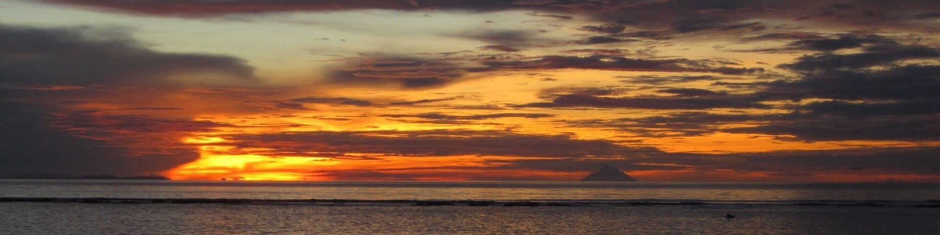 Sunset off the coast of Kar Kar Island in the Bismarck Sea, Papua New Guinea.