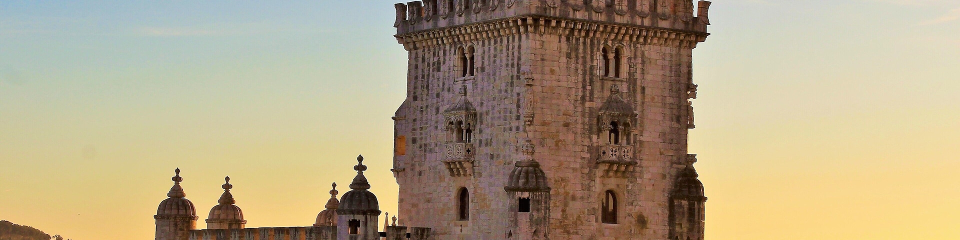 I took this in March at Belém Tower, in Lisbon, Portugal. And came at just the right time - sunset time! And yet there were still quite a few people lazying about :). It was a beautiful Spring day there!
This fortified tower is a UNESCO World Heritage Site and one of the most iconic sites in Lisbon! Built in the early 16th-century, it played a significant role in the Age of Discoveries. The tower was commissioned by King John II to be part of a defense system at the mouth of the Tagus river and a ceremonial gateway to Lisbon. The structure was built from Lioz limestone and is composed of a bastion and a 30 m (98.4 ft),four storey tower. It's impressive to see in person! Thanks to Wikipedia for the info, as well ;).