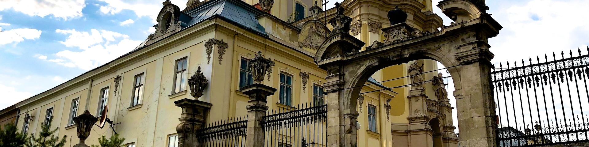 Located on St. George Hill, over-looking the city of Lviv, the church was the perfect target for destruction in the past. At least two versions of the St. George Cathedral were built before the final construction of the church as it is seen today. The Cathedral of St. George became the mother congregation of the Greek-Catholic religion in Ukraine.
The St. George Cathedral in Lviv, is home to one of the most treasured relics, which was brought to the cathedral by Bishop Jiseph Shumlianskyi in 1674. It is the Icon of the Virgin Mary, and is a spectacular and preserved artifact. The interior was decorated with luxurious embellishments created by the local artistic talents of Lviv. Pinsel, the sculptor of the cathedral, created the spectacular St. George (known as the Dragon Slayer) statue. The St. George statue can be viewed in the attic of the cathedral, while the intimidating statues of St. Athanasius and St. Leo protect the portal.
Renovations to the St. George Cathedral took place in the 1996, restoring the original beauty of the cathedral. Tourists, visiting this amazing historical masterpiece will not be disappointed. Over and above the cathedral, visitors can also visit the belfry, walk through the peaceful gardens or enter the final resting place of many important figures of the past in the tombs below the cathedral.