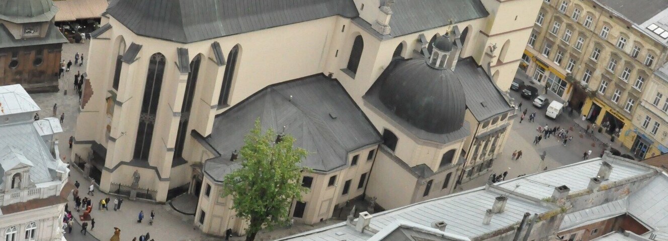 Lovely view of old Lviv from the top of the tower in the center of Ploscha Rynok. That's the Latin Cathedral, one of the oldest still-active churches in the city. To climb the tower, go up the first four flights of stairs to the ticket desk. The way is clearly marked with signs in multiple languages, including English. At the desk, pay 10 hrivna and then keep climbing up, up, and up until you reach the open deck at the top of the tower. Then enjoy the view!