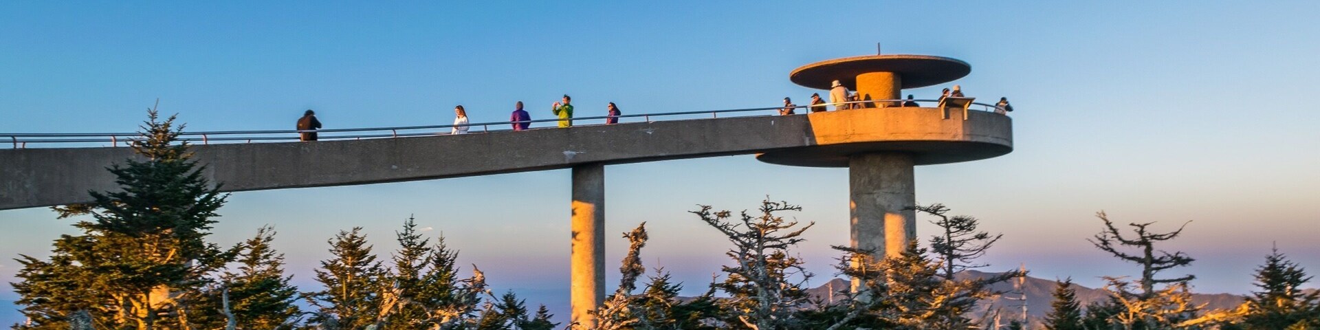 Clingmans Dome is the highest point in the Great Smoky Mountains National Park.
The observation tower on the summit of Clingmans Dome offers spectacular 360° views of the Smokies and beyond for visitors willing to climb the steep half-mile walk to the tower at the top.
Although Clingmans Dome Observation Tower is open year-round, the road leading to it is closed from December 1 through March 31, and whenever weather conditions require.
Pets and bicycles are not permitted on the paved trail to the observation tower, or on any other trails in the area.