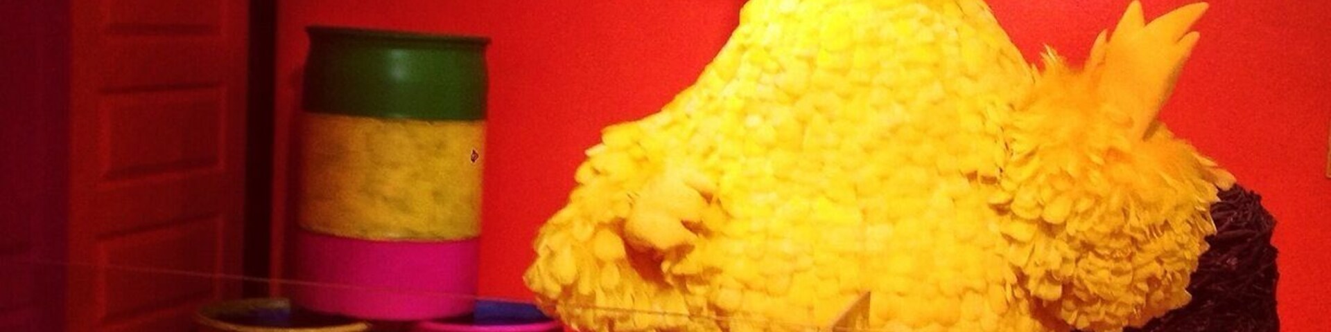 Big Bird standing tall in the Somebody Come and Play FREE exhibit