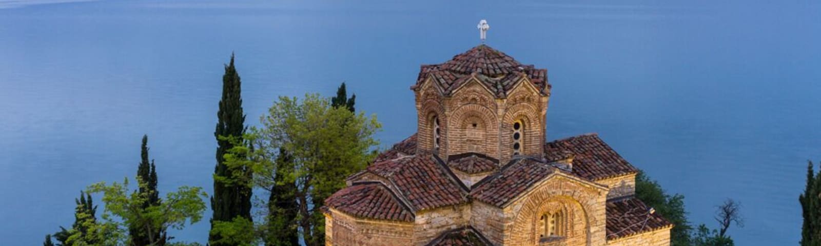 Saint John at Kaneo is a Macedonian Orthodox Church built in the 13th century. It is located on the cliff over Kaneo Beach at Ohrid lake and the most popular photo motif when visiting Ohrid, maybe the most popular in whole North Macedonia. We went there for sunrise to get good light for taking a picture from above, but it is also a great location in the evening since the sunsets in Ohrid are often spectacular.
#NorthMacedonia #Ohrid #Church #Architecture #Bluehour #Culture #Trovember