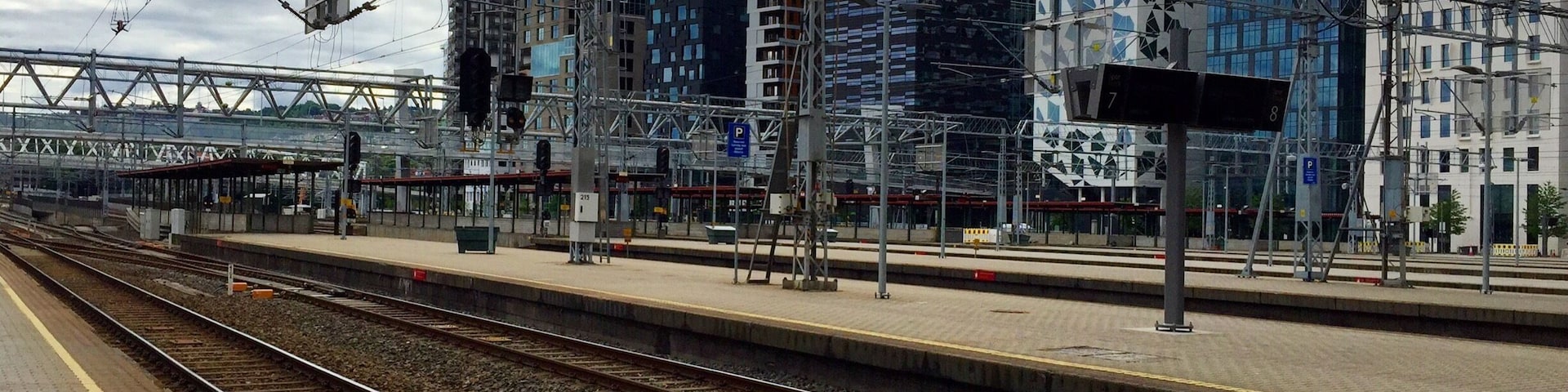 I like the mixture of modern buildings and tracks and wires.