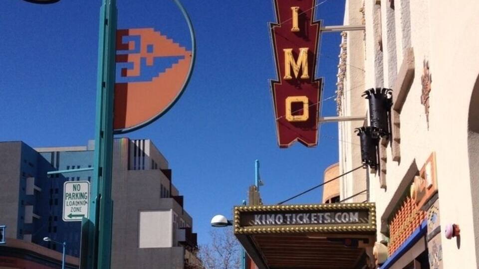 The KiMo Theatre, a Pueblo Deco building, was erected in 1927 on Central Avenue in downtown Albuquerque. It is home to plays, films, operas, and various other productions year-round.