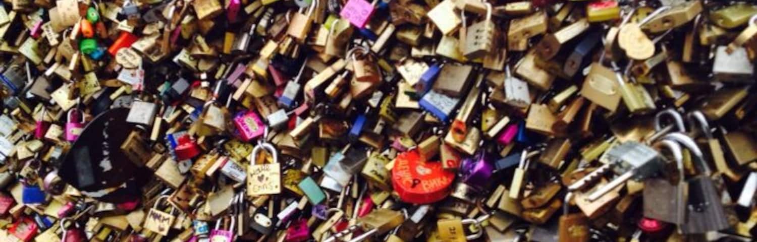 Pont des Artes Pedestrian bridge near the Louvre. Also known as Love Lock Bridge. People write their names on the locks, place it on the bridge and toss the keys into the Seine to show Devotional Love.